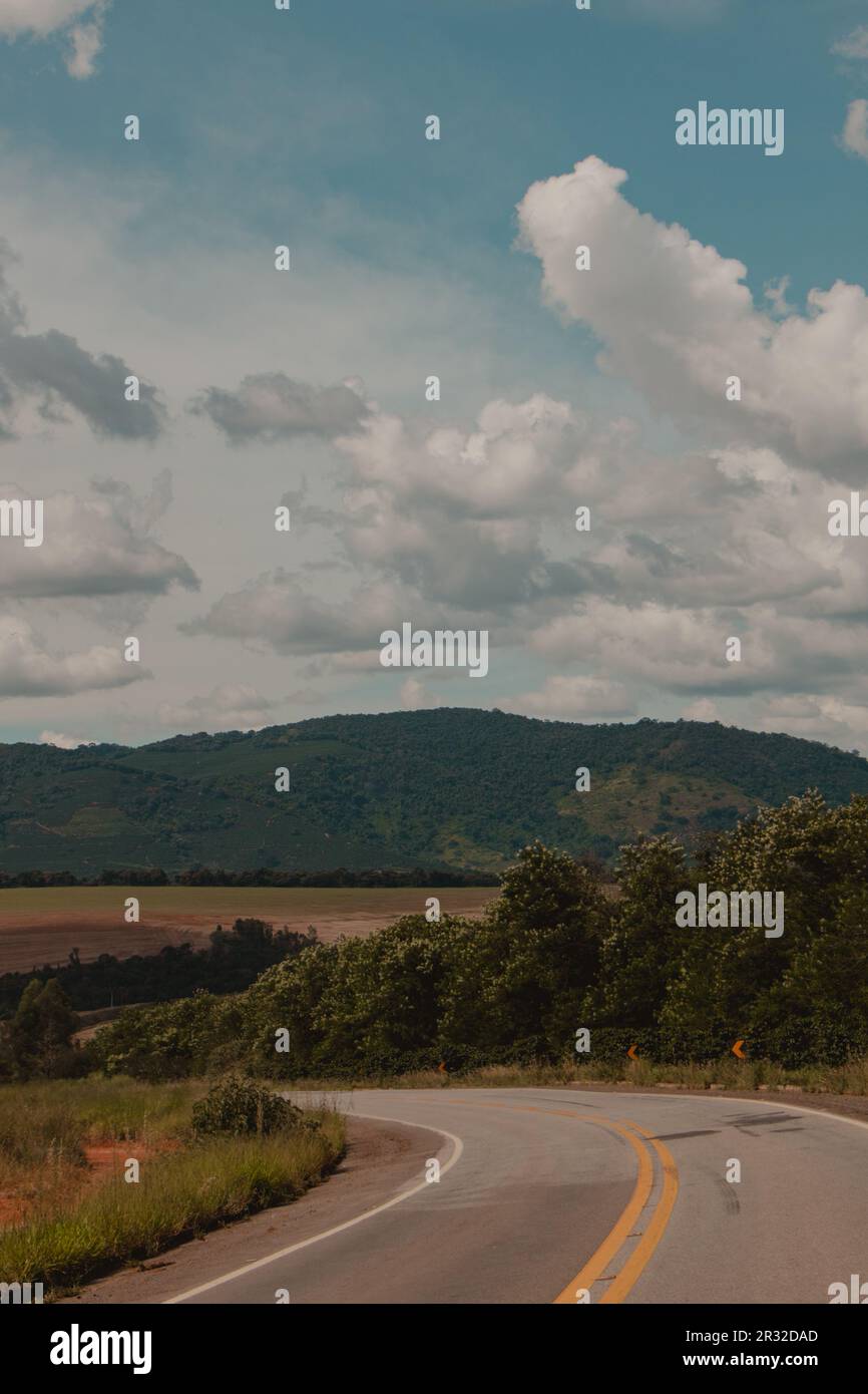 asphalt road turning left Stock Photo - Alamy
