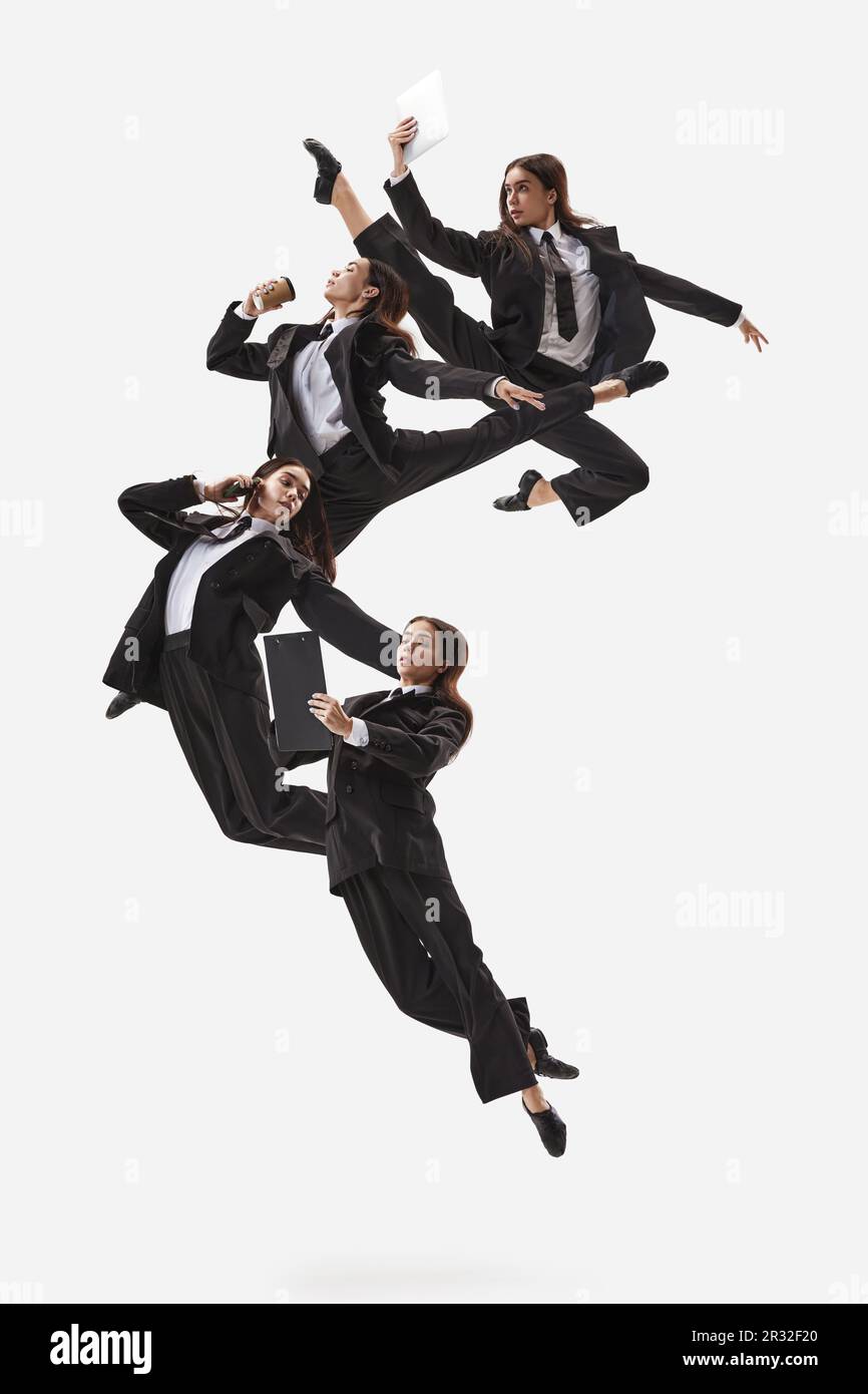 Happy office worker doing office work and dancing in classic clothes ...