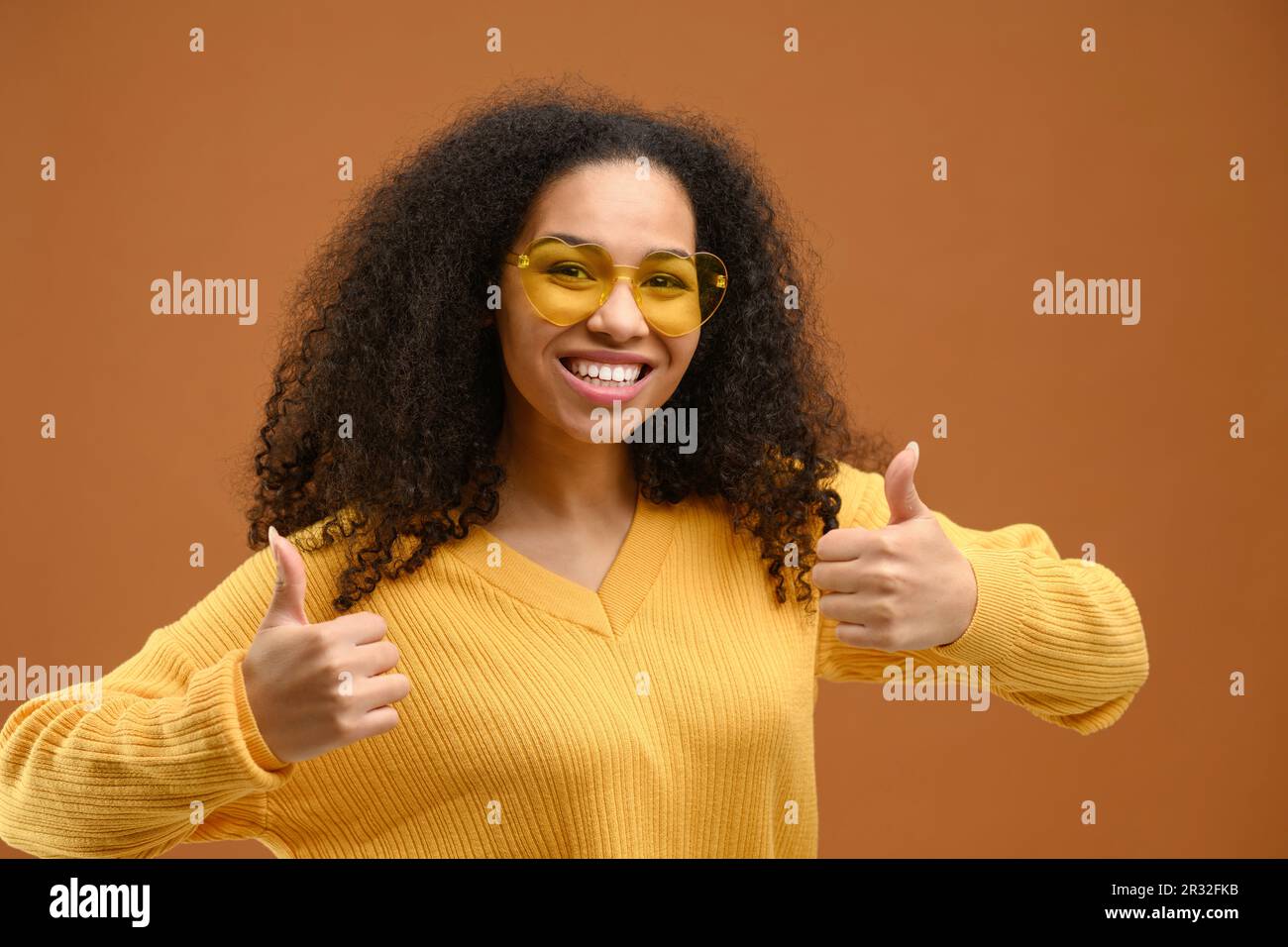 Well done, good job. Waist up portrait of joyful brunette woman showing ...