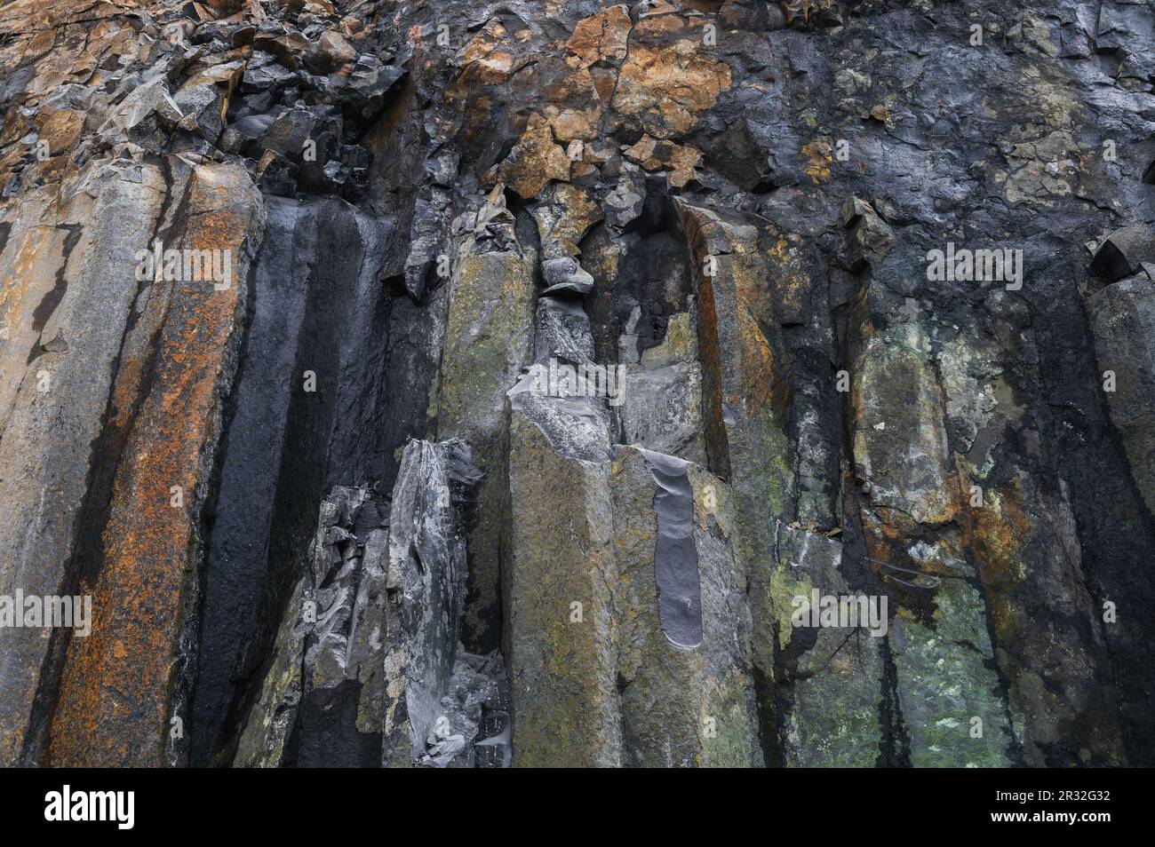 Basalt pillars in a quarry. Natural basalt rock columns closeup texture ...