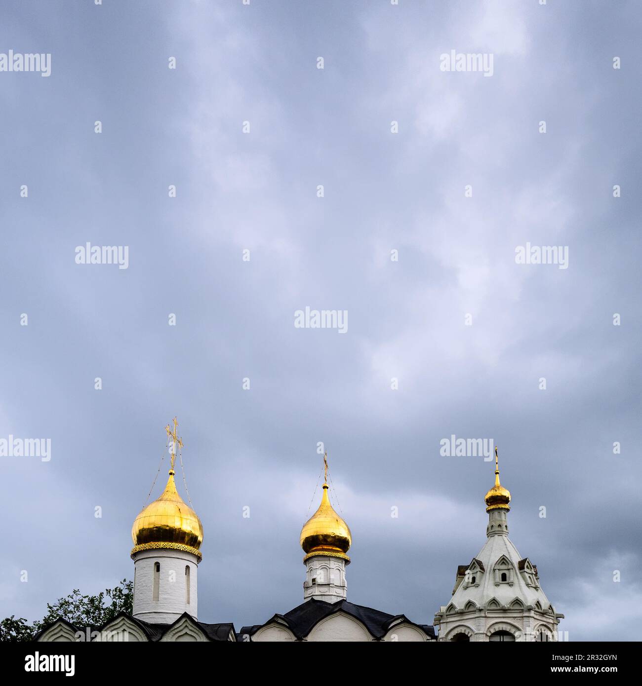 gray cloudy sky over golden domes of orthodox churches Stock Photo - Alamy