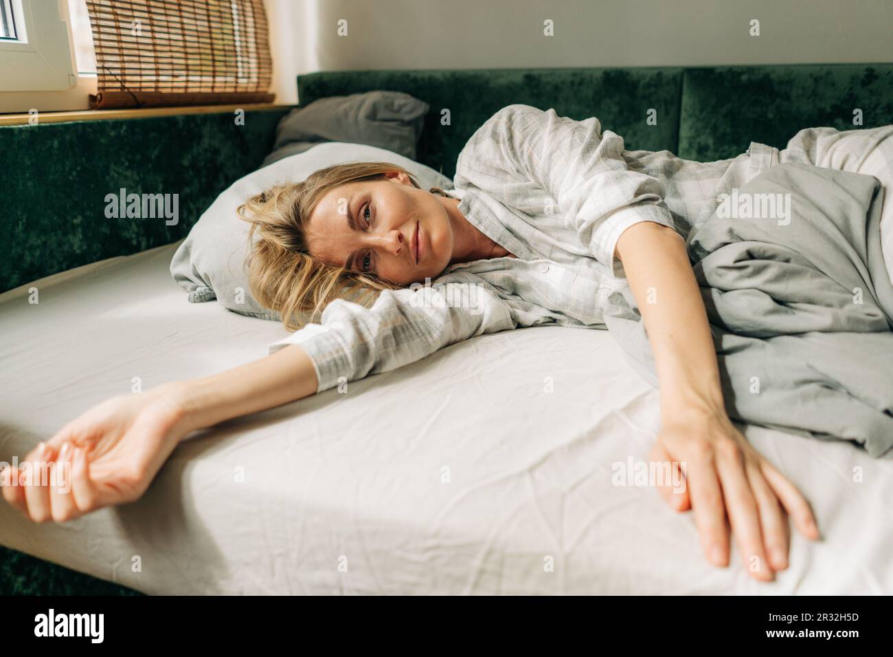 Girl lies in bed hi-res stock photography and images - Alamy
