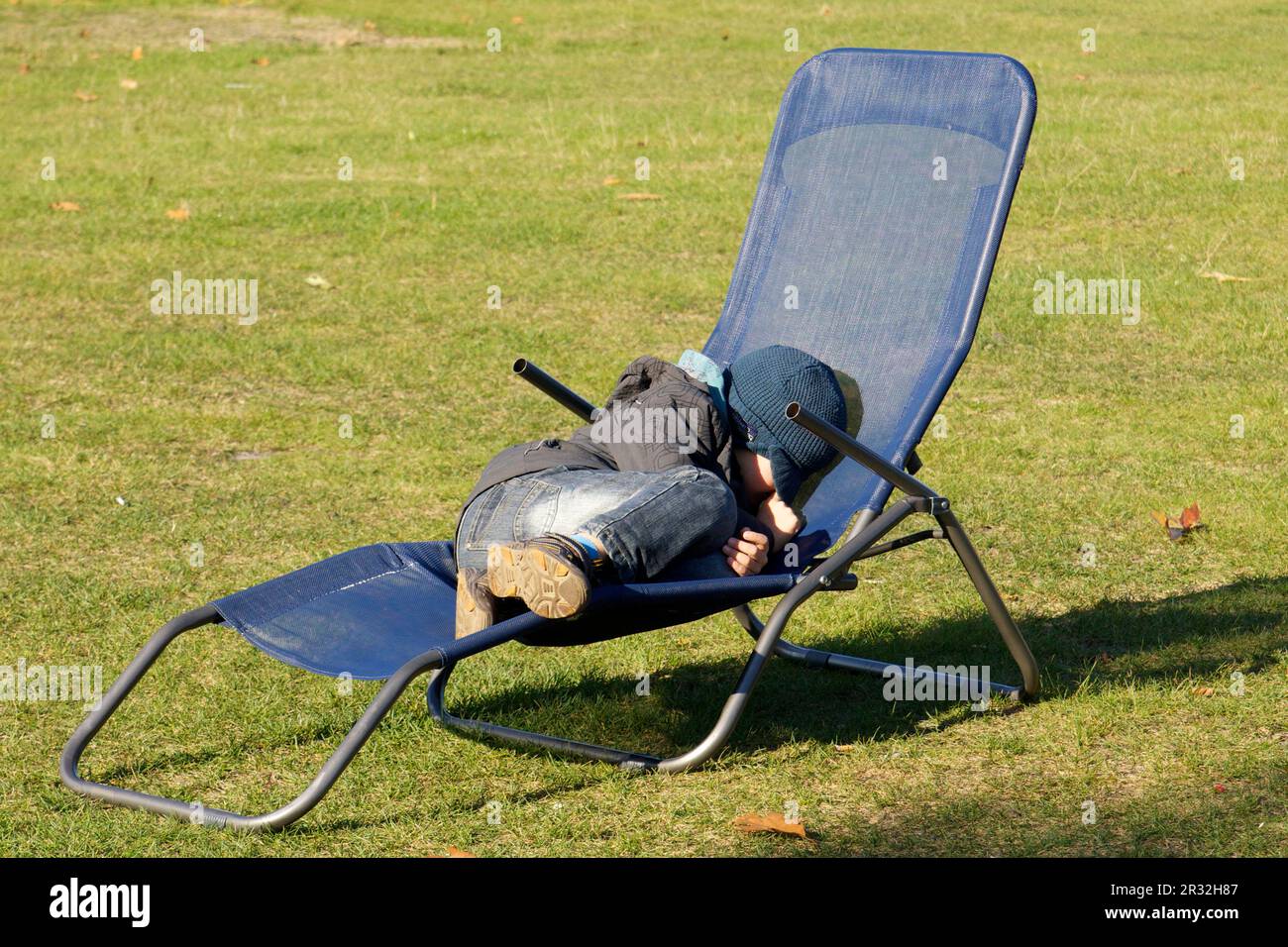 Boy on chair hi-res stock photography and images - Alamy