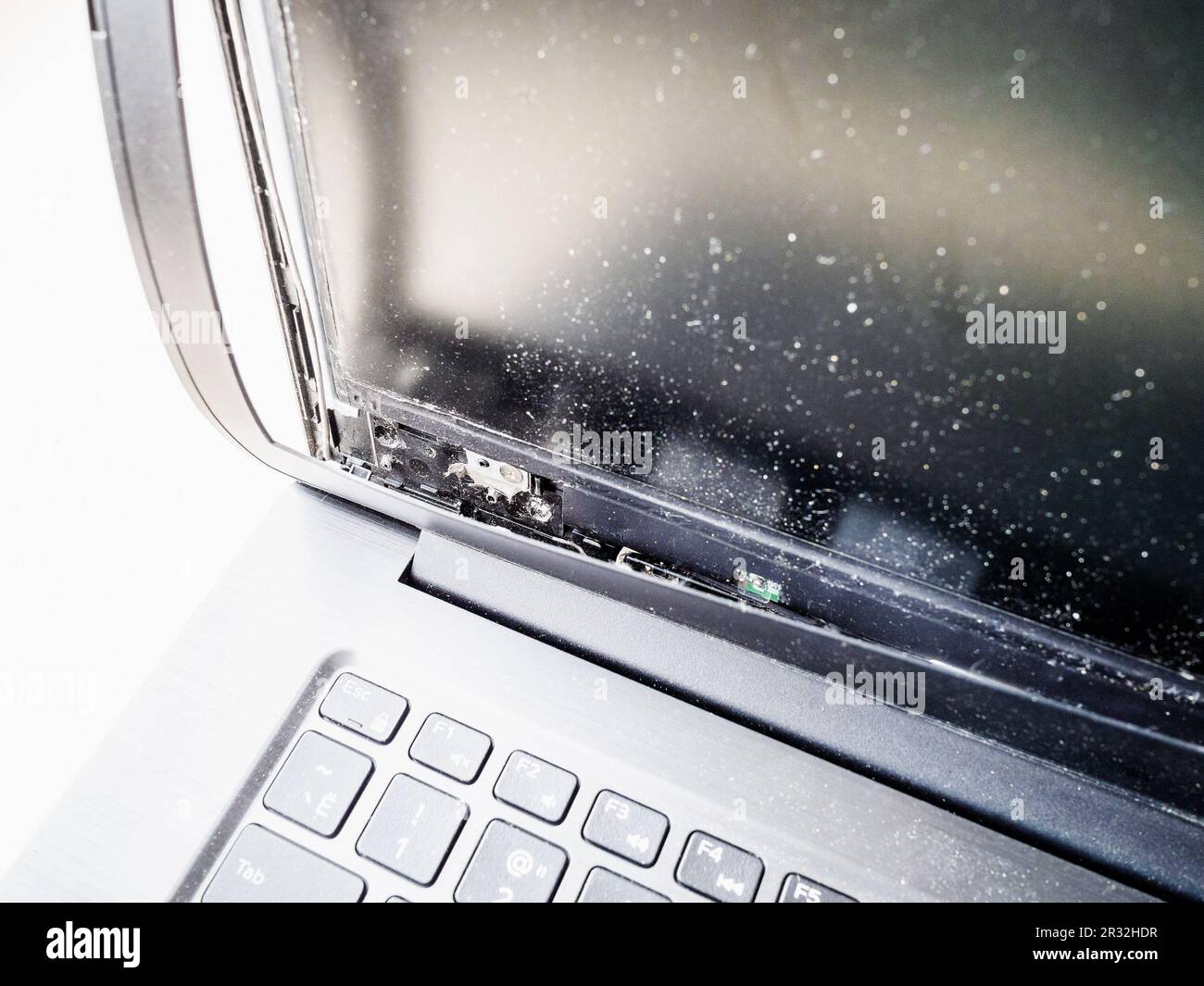 broken screen mount of old laptop close up on table Stock Photo - Alamy
