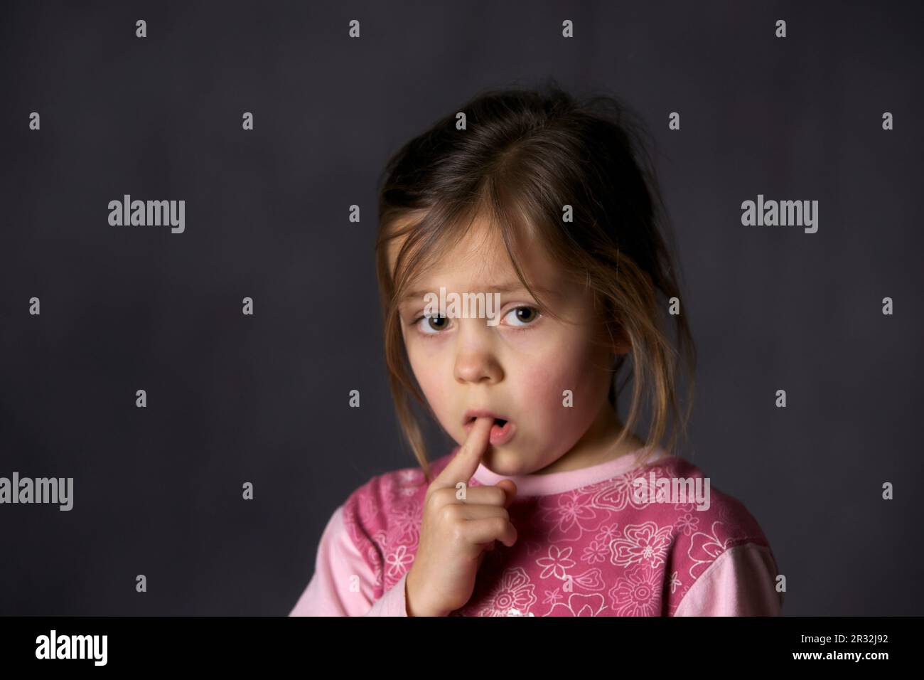Child finger in mouth Stock Photo - Alamy