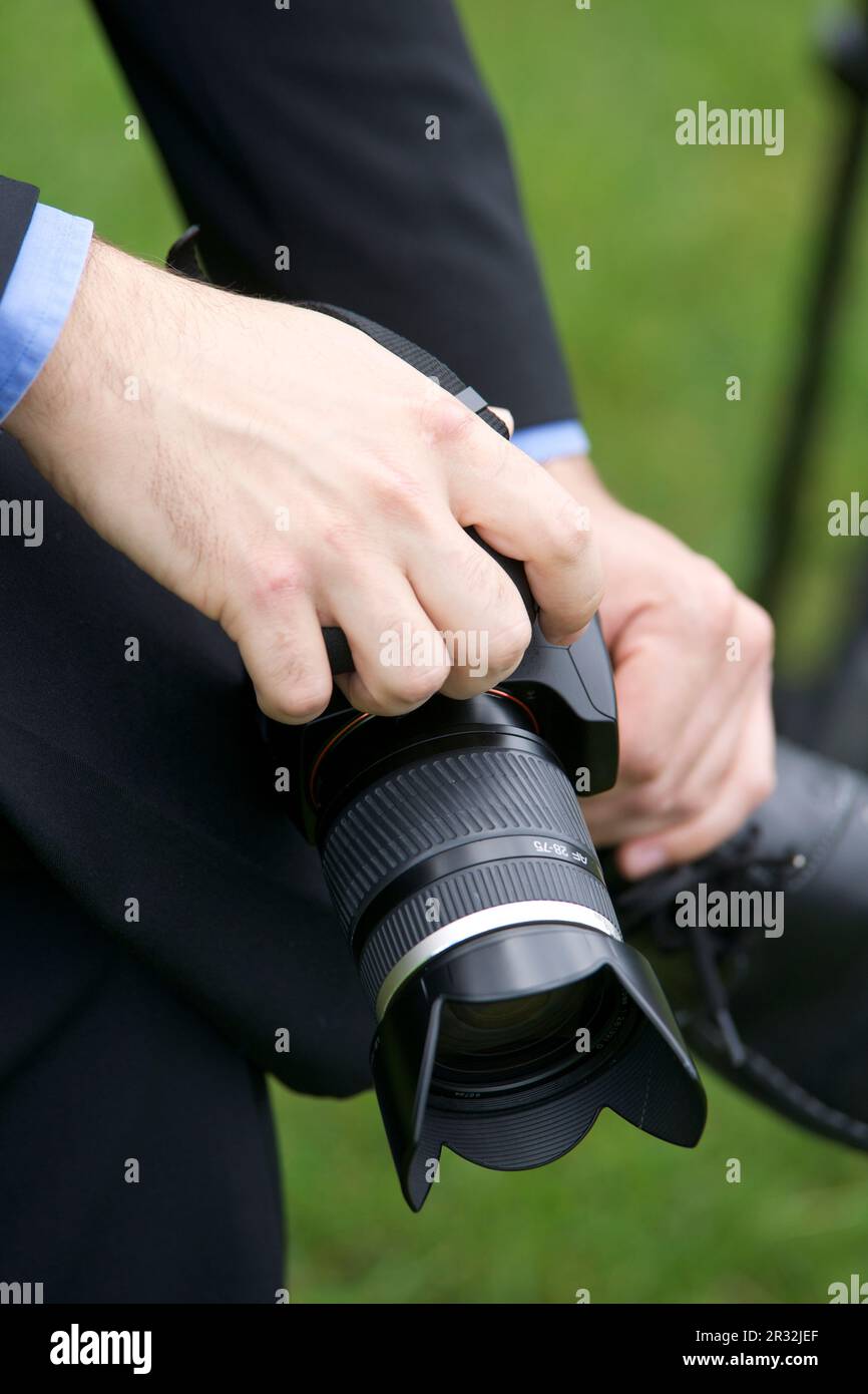 Photograph hold camera Stock Photo - Alamy