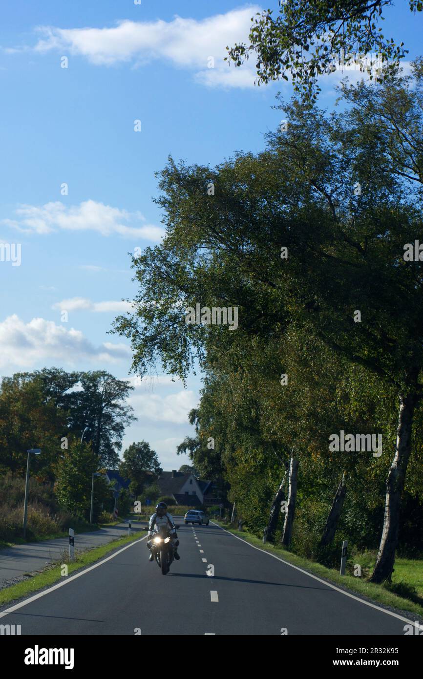 Biker on road Stock Photo - Alamy