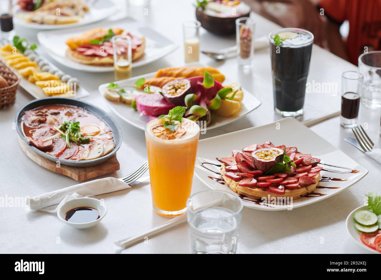 Brunch table setting with various delicious food Stock Photo - Alamy