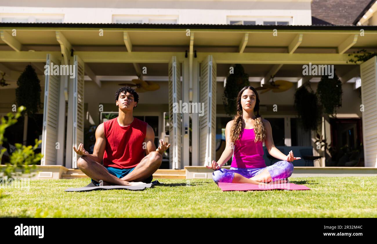 Happy diverse couple practicing yoga hi-res stock photography and ...