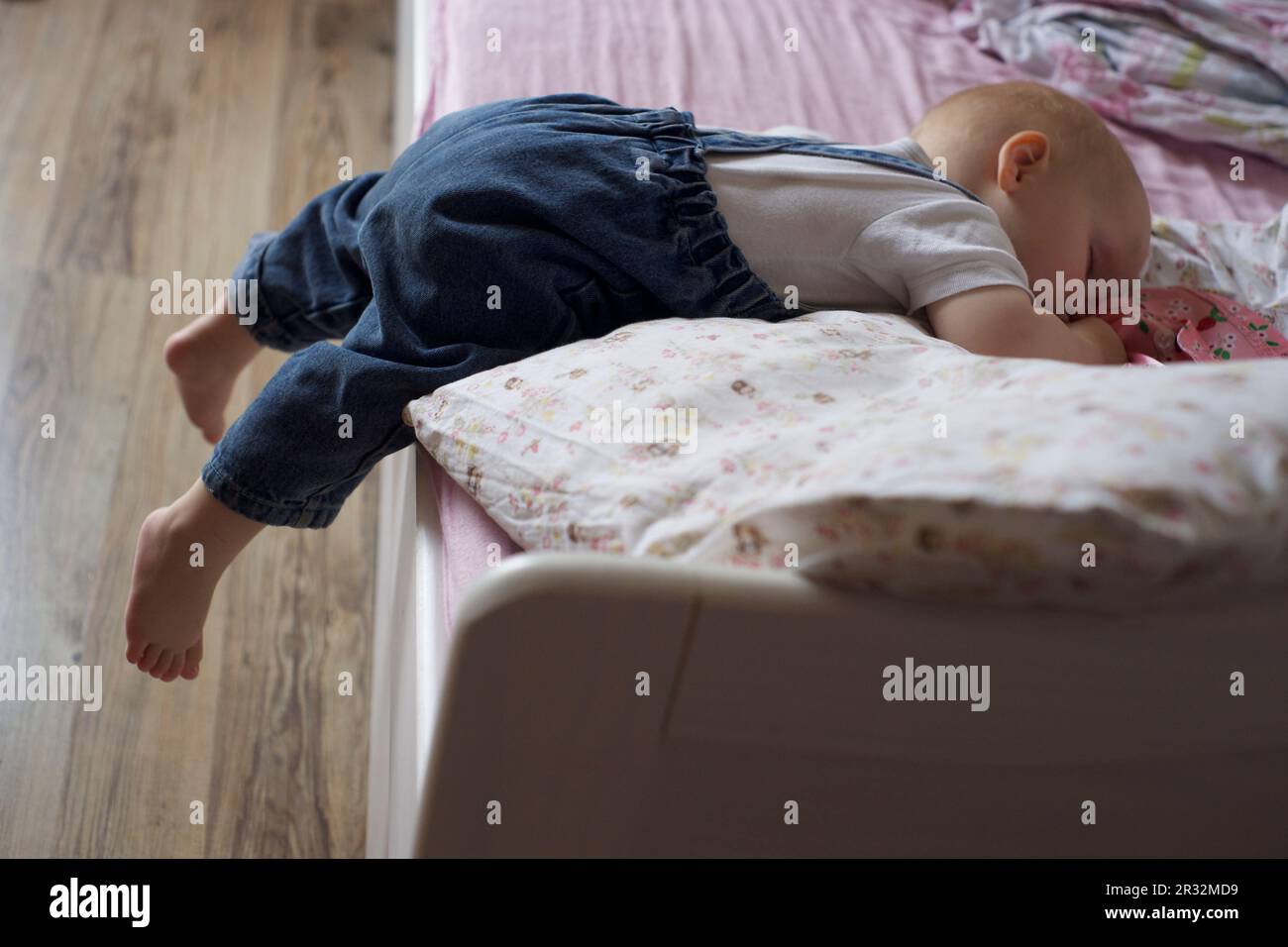 Boy sleep on the edge Stock Photo - Alamy