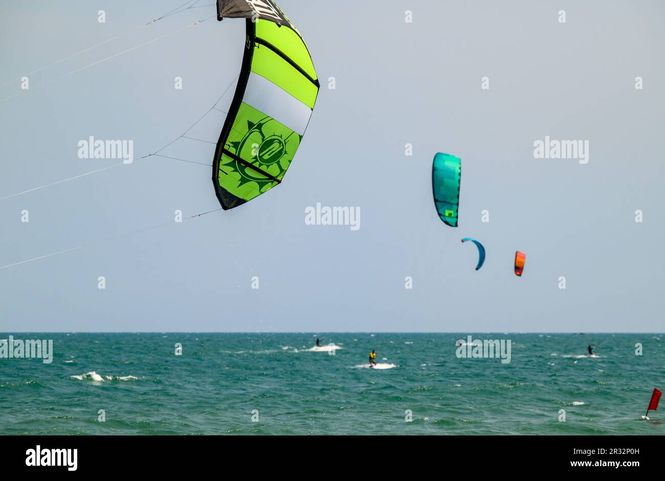 Kitesurfers in action off the beach in Mui Ne, Vietnam Stock Photo - Alamy