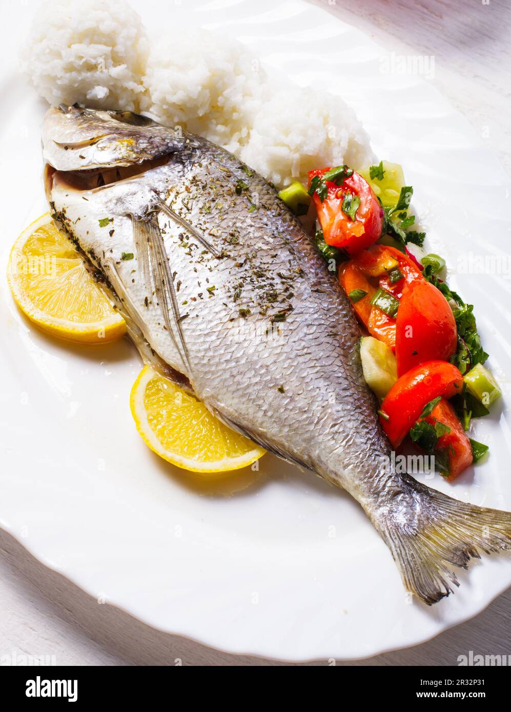 Garnishing fish hi-res stock photography and images - Alamy