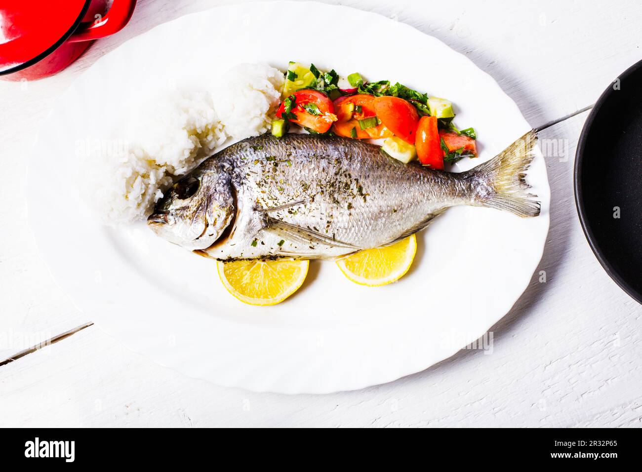 Baked dorado fish Stock Photo - Alamy