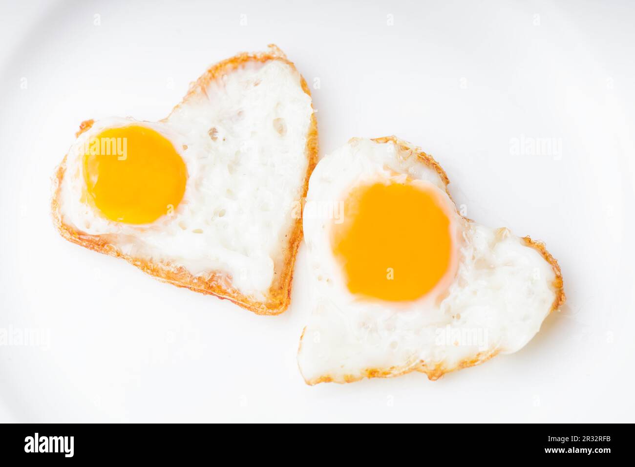 Heart fried eggs Stock Photo - Alamy