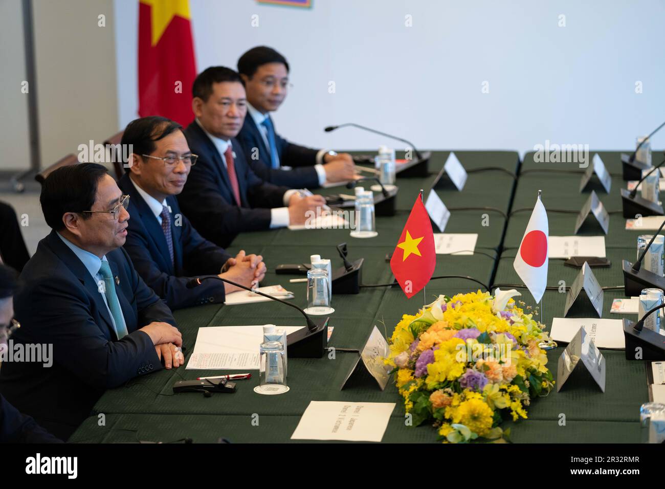 Hiroshima, Japan. 21st May, 2023. Vietnam's Prime Minister Pham Minh Chinh (L) speaks during a ...