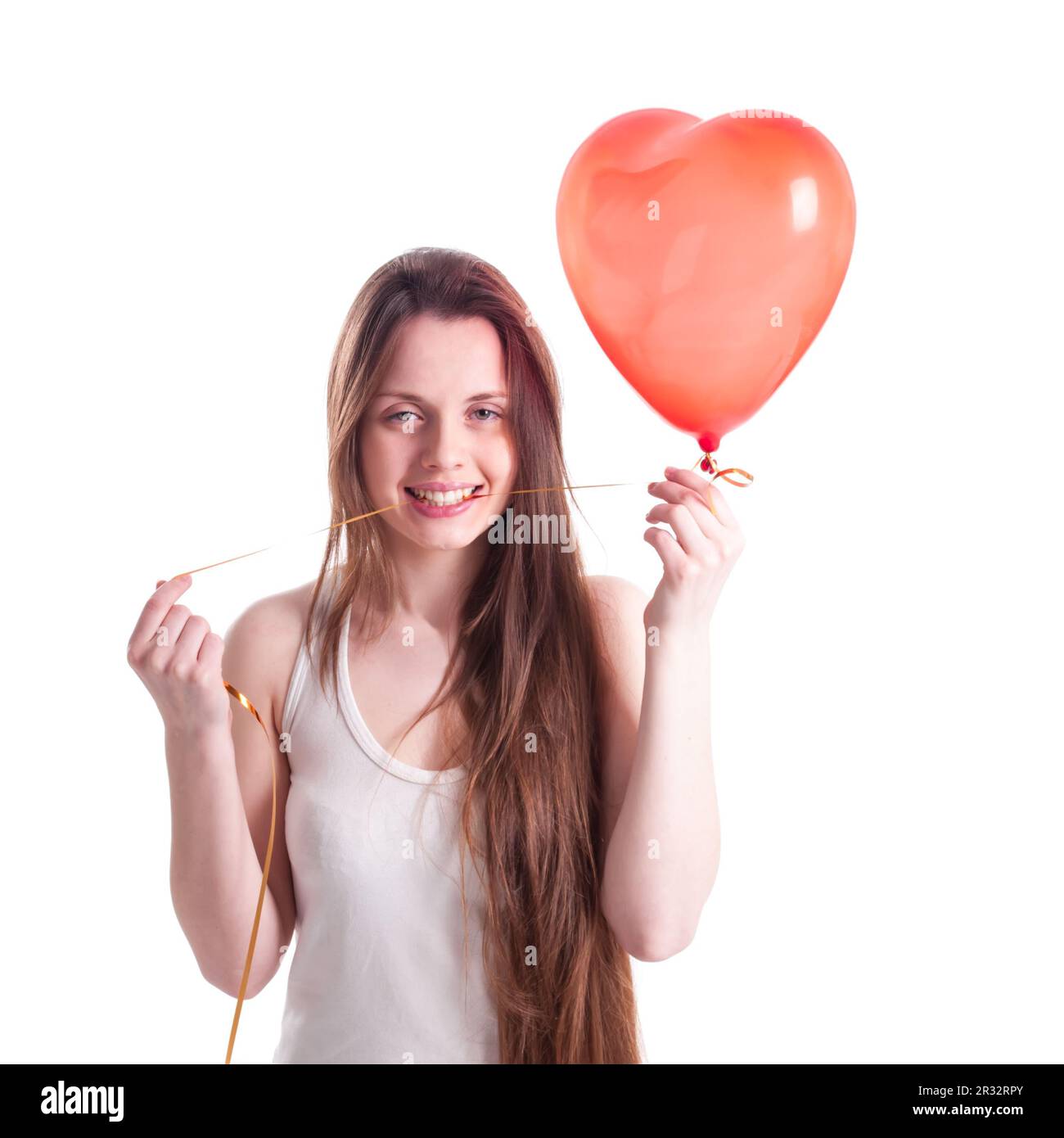 Girl with red balloon heart Stock Photo - Alamy