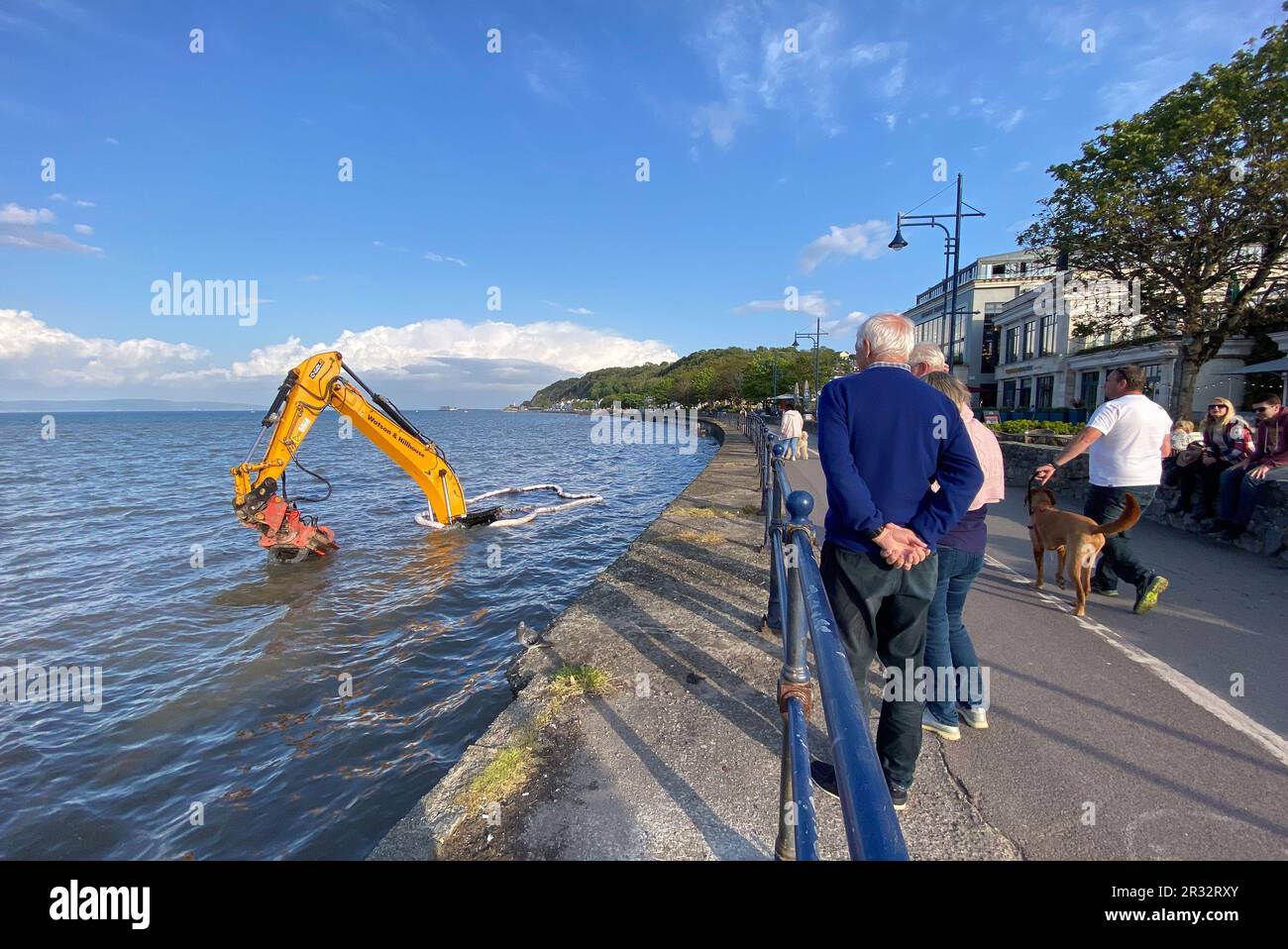The mechanical digger which ended up submerged at high water in Mumbles ...