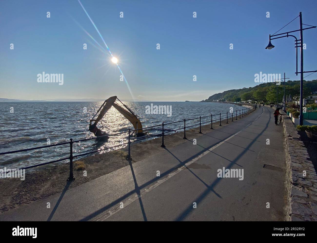 The mechanical digger which ended up submerged at high water in Mumbles ...