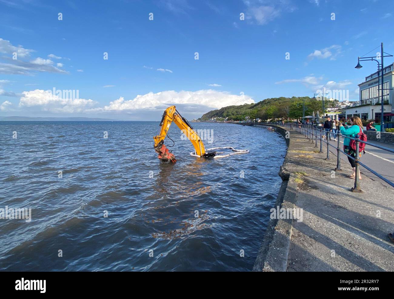 The mechanical digger which ended up submerged at high water in Mumbles ...