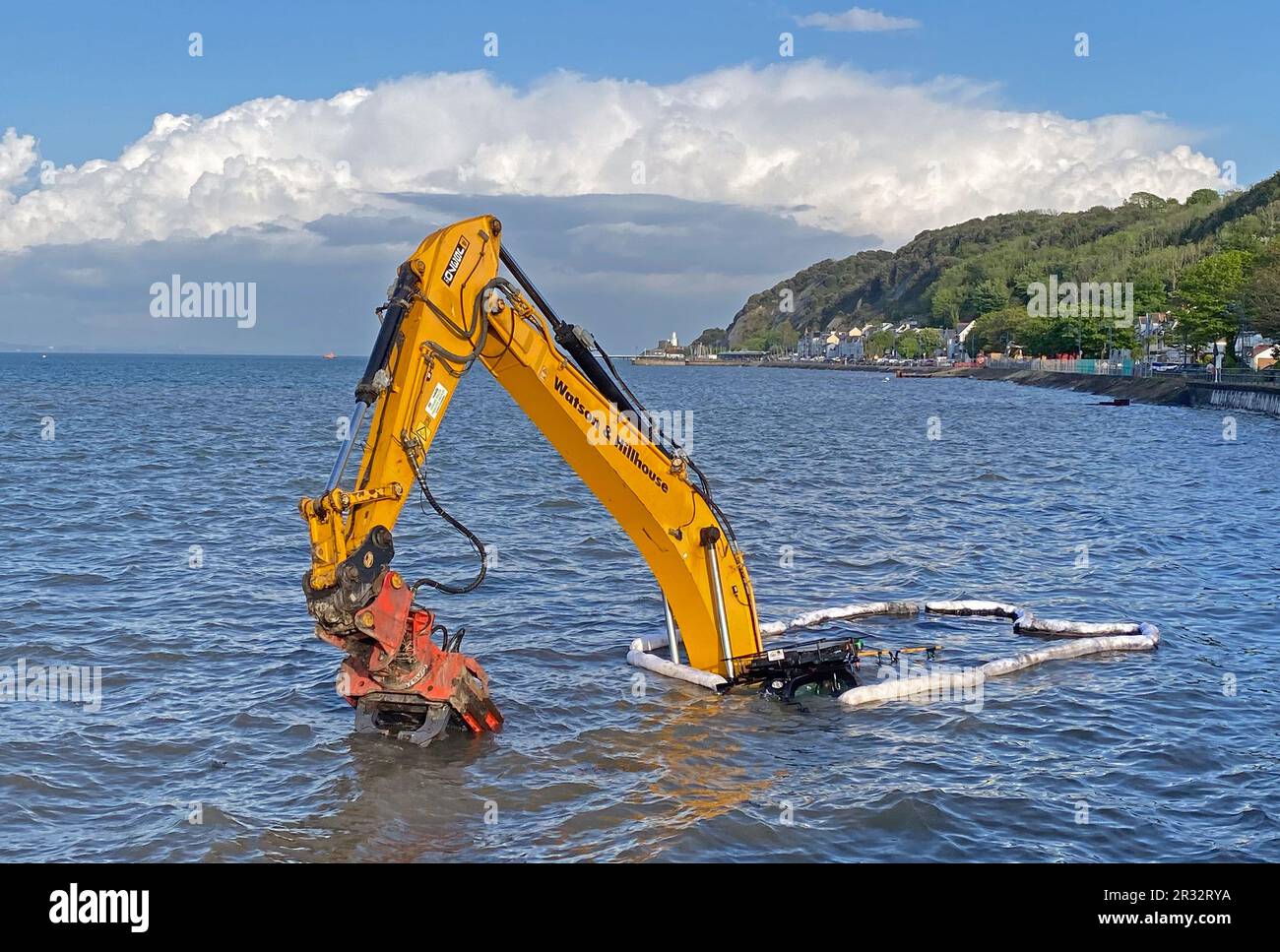 The mechanical digger which ended up submerged at high water in Mumbles ...