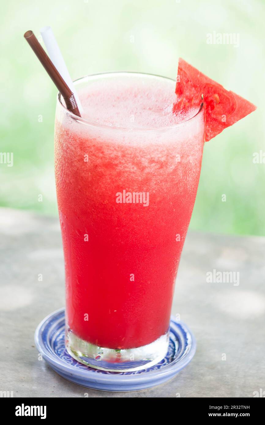Red water melon fruit juice frappe with melon piece Stock Photo - Alamy