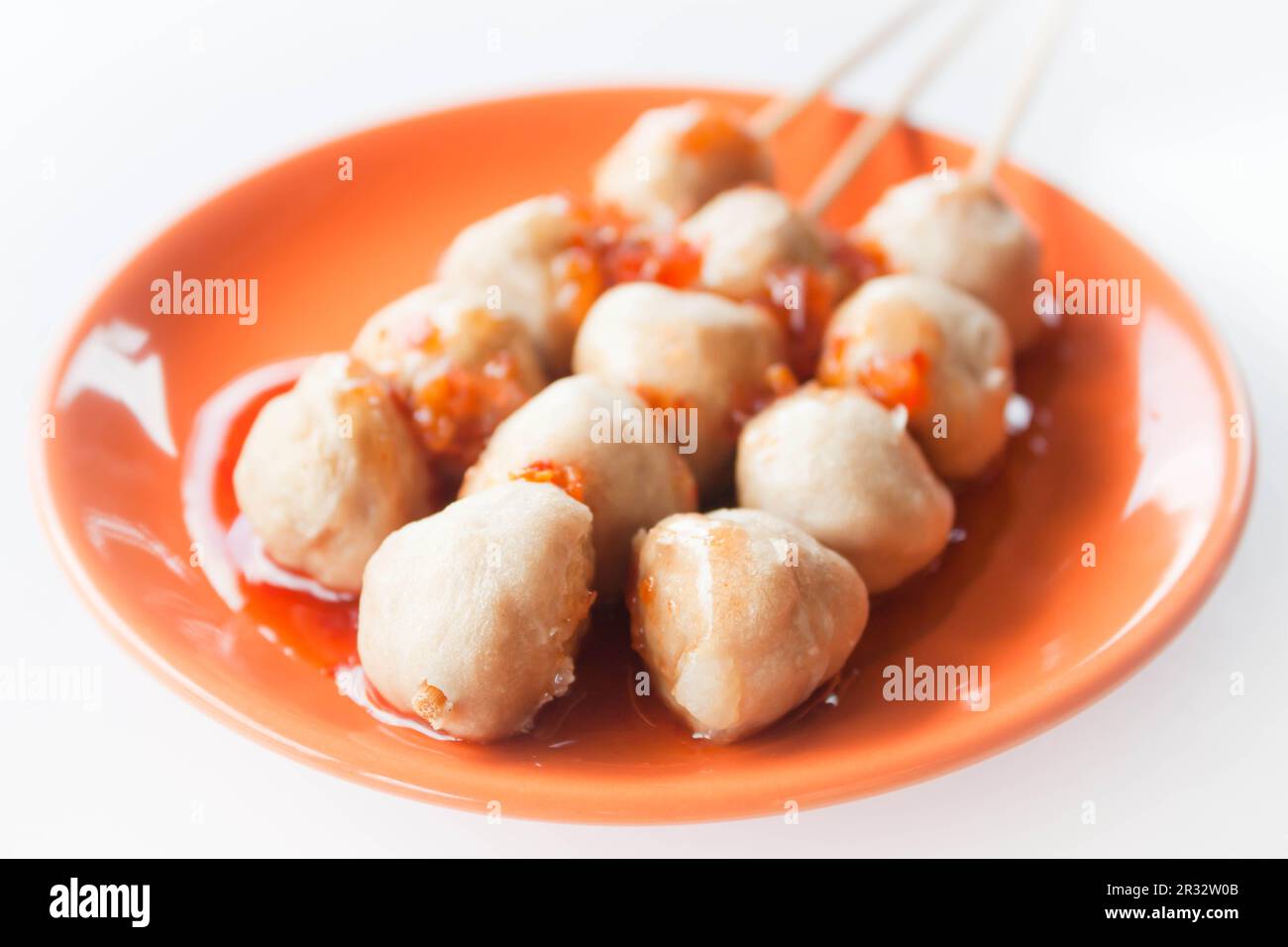 Mini pork balls in orange dish on clean table Stock Photo - Alamy