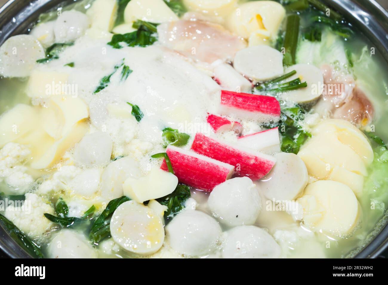 Boiling suki soup in big bowl Stock Photo - Alamy
