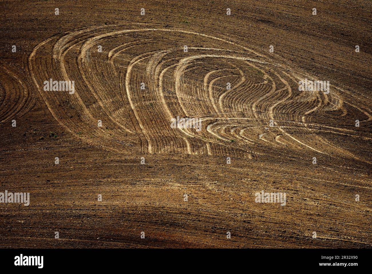 Rolling plowed farm field with furrows and marks or rows texture Stock ...