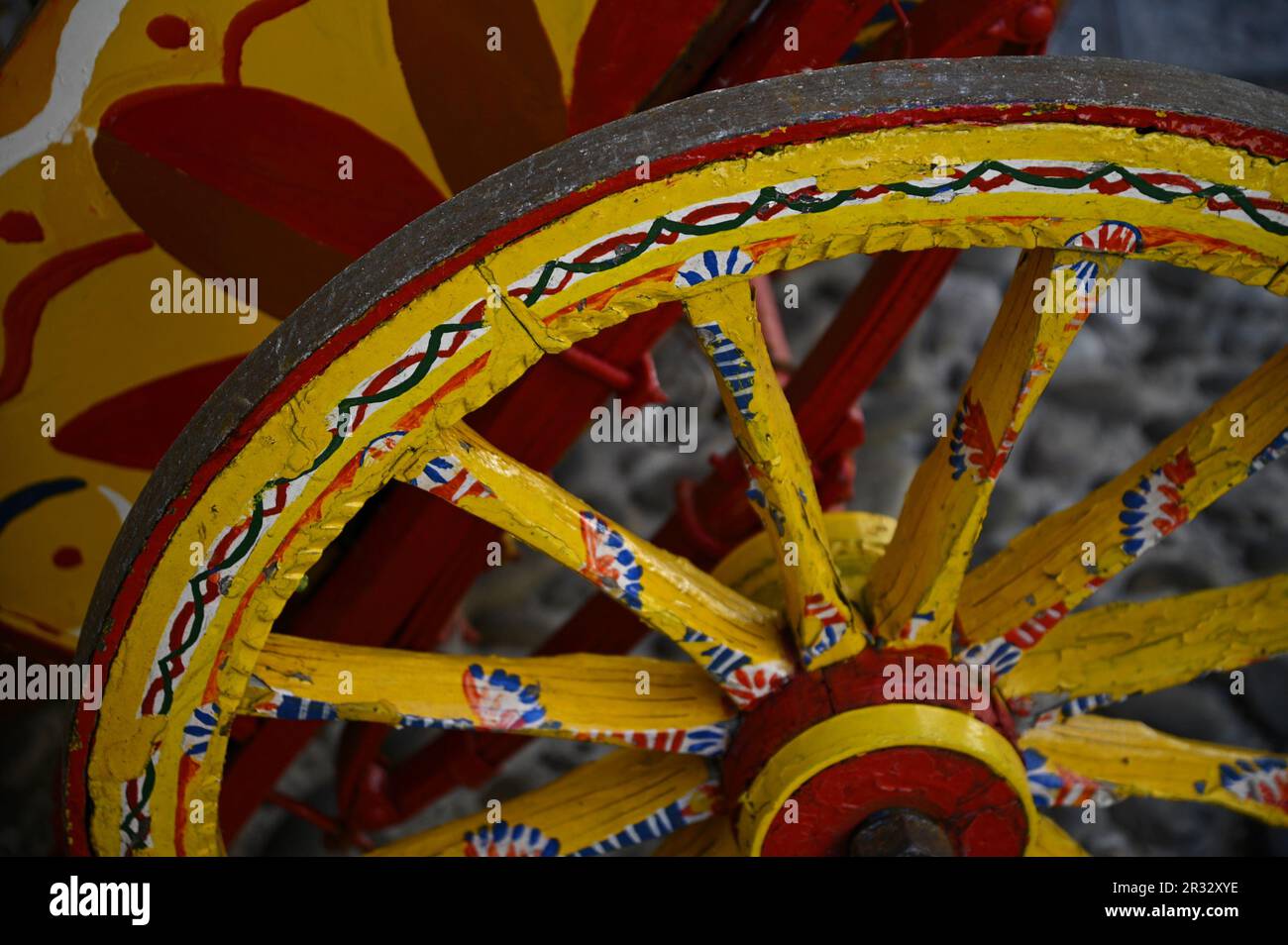 Traditional horse cart wheel decorated with colorful Sicilian folk ...