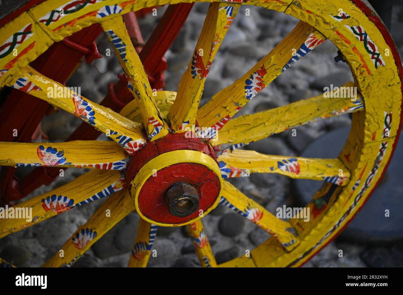 Traditional horse cart wheel decorated with colorful Sicilian folk ...
