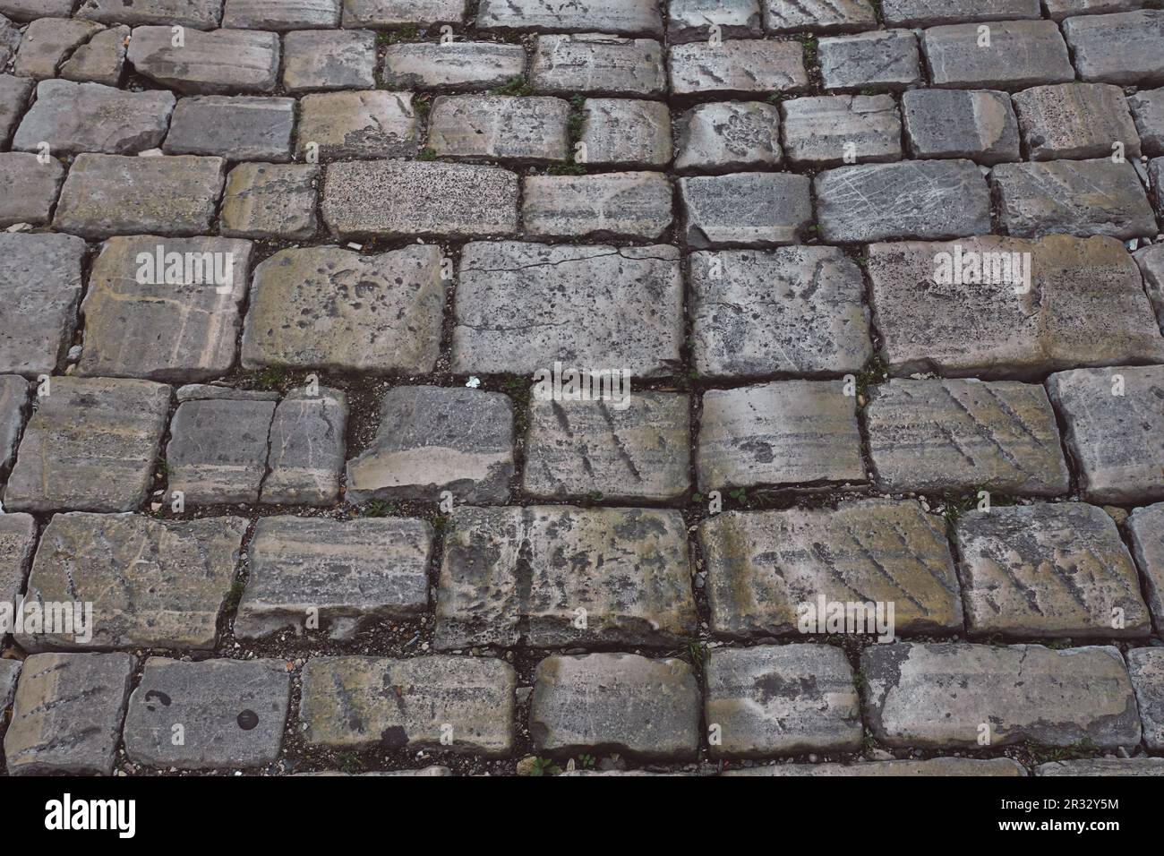 Stone pavement texture. Granite cobblestoned pavement background. Abstract background of old ...