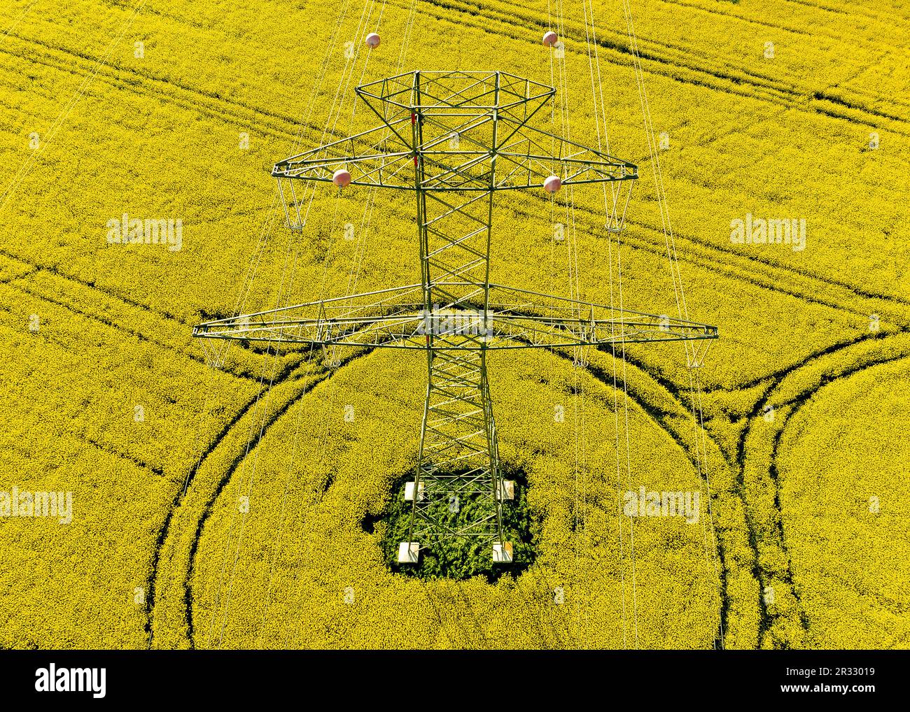 high voltage electrical transmission tower in an agriculture field ...
