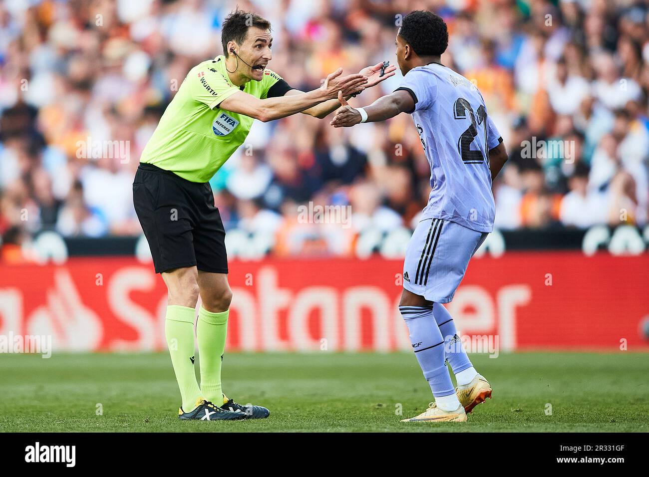 Referee Ricardo de Burgos Bengoetxea talks with Rodrygo Silva de Goes ...