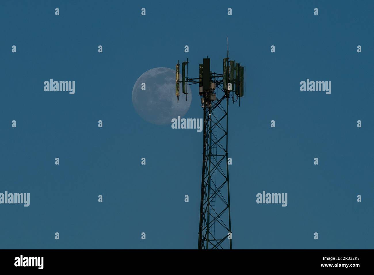 Moon Rising Behind a Cell Tower. Oregon, Ashland, Spring Stock Photo ...