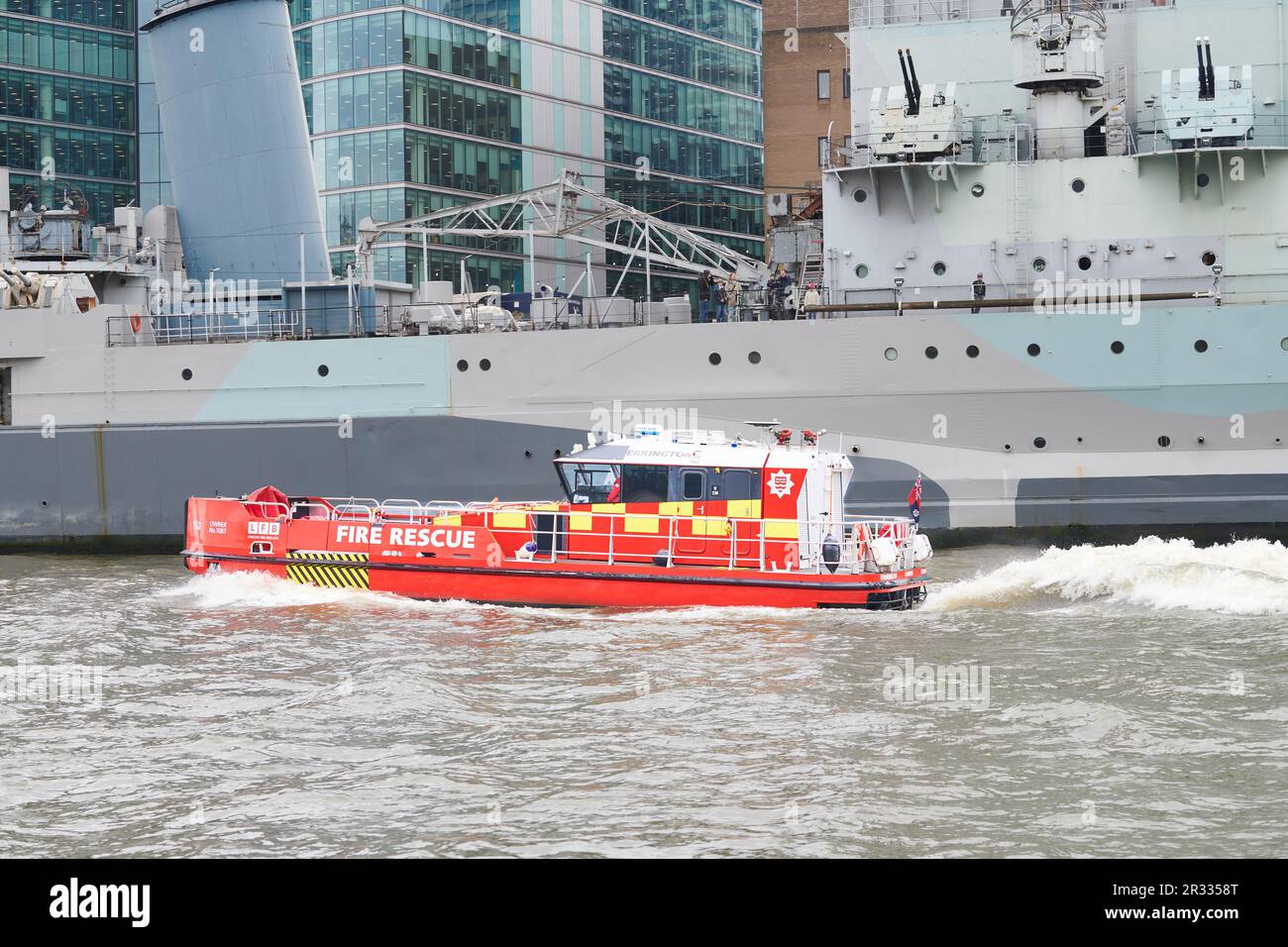 A fire rescue tender of the London Fire Brigade speeds past the battle ...