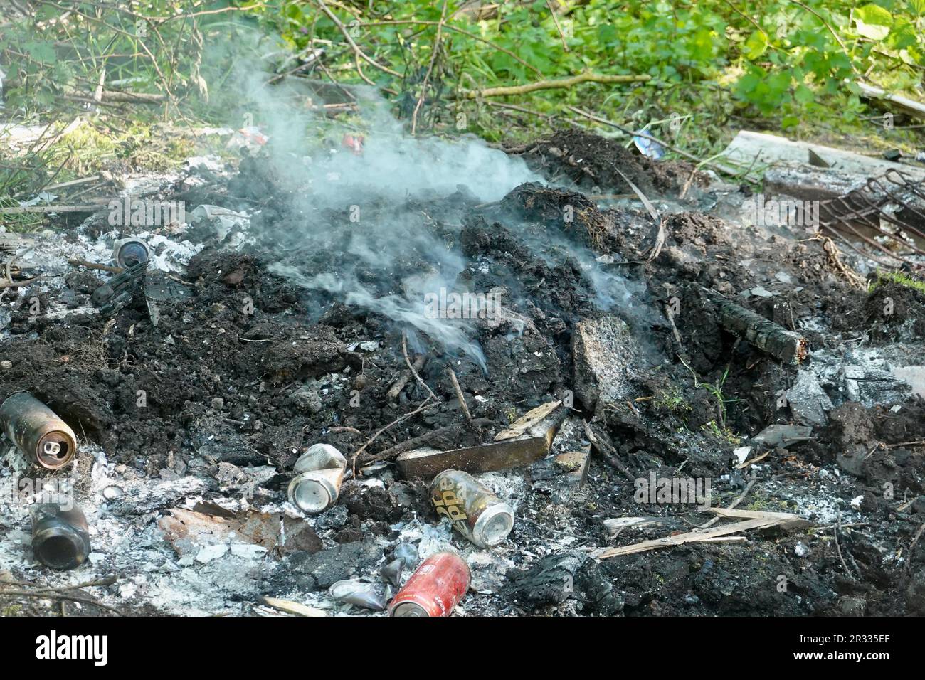 Smouldering rubbish in a wood in New Mills, Derbyshire Stock Photo - Alamy