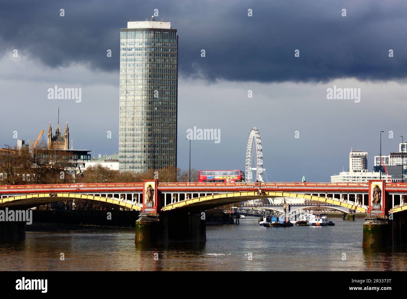 Millbank Tower, London Eye / Millennium Wheel and red London bus ...