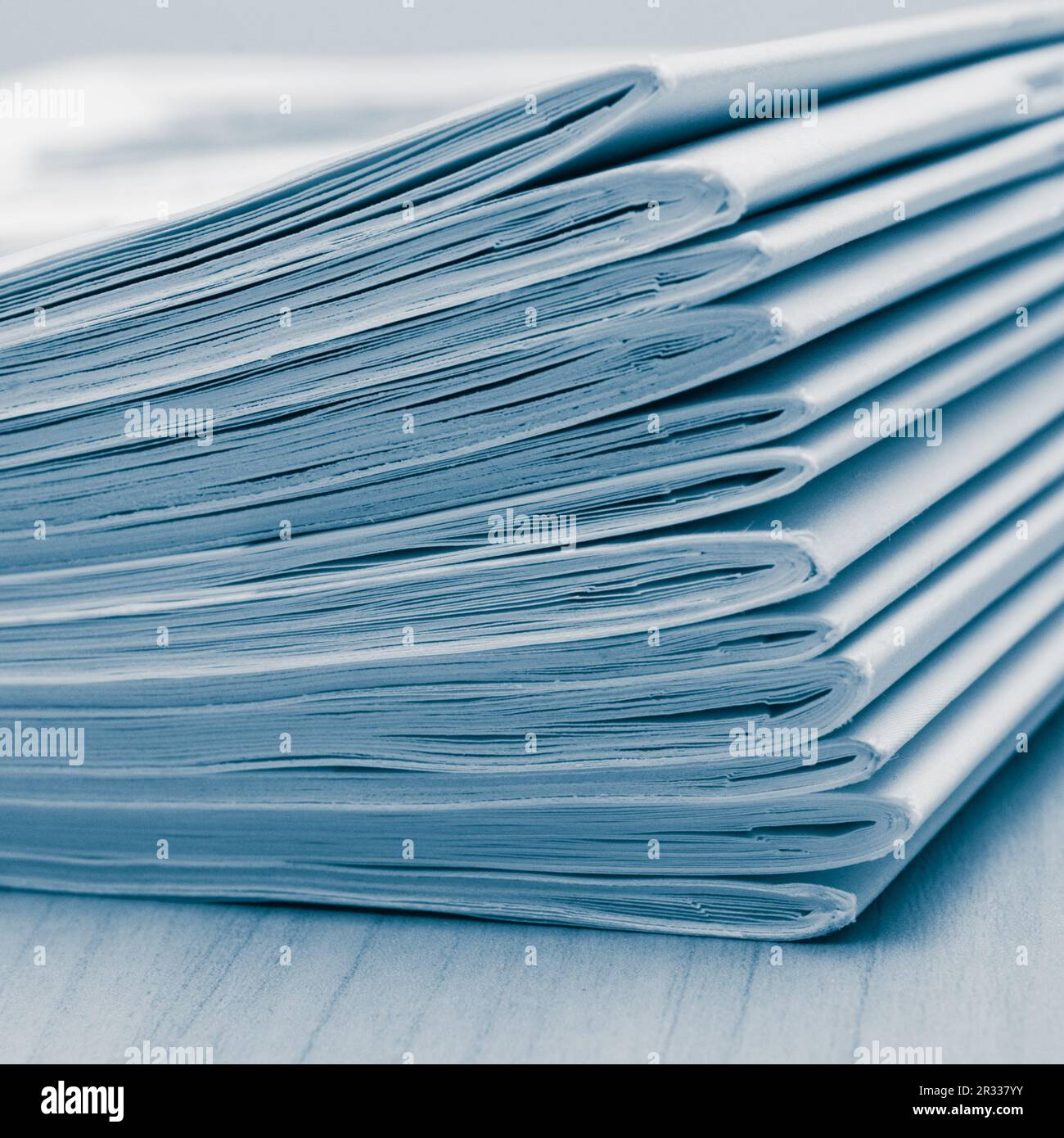 Stack of white journals Stock Photo - Alamy