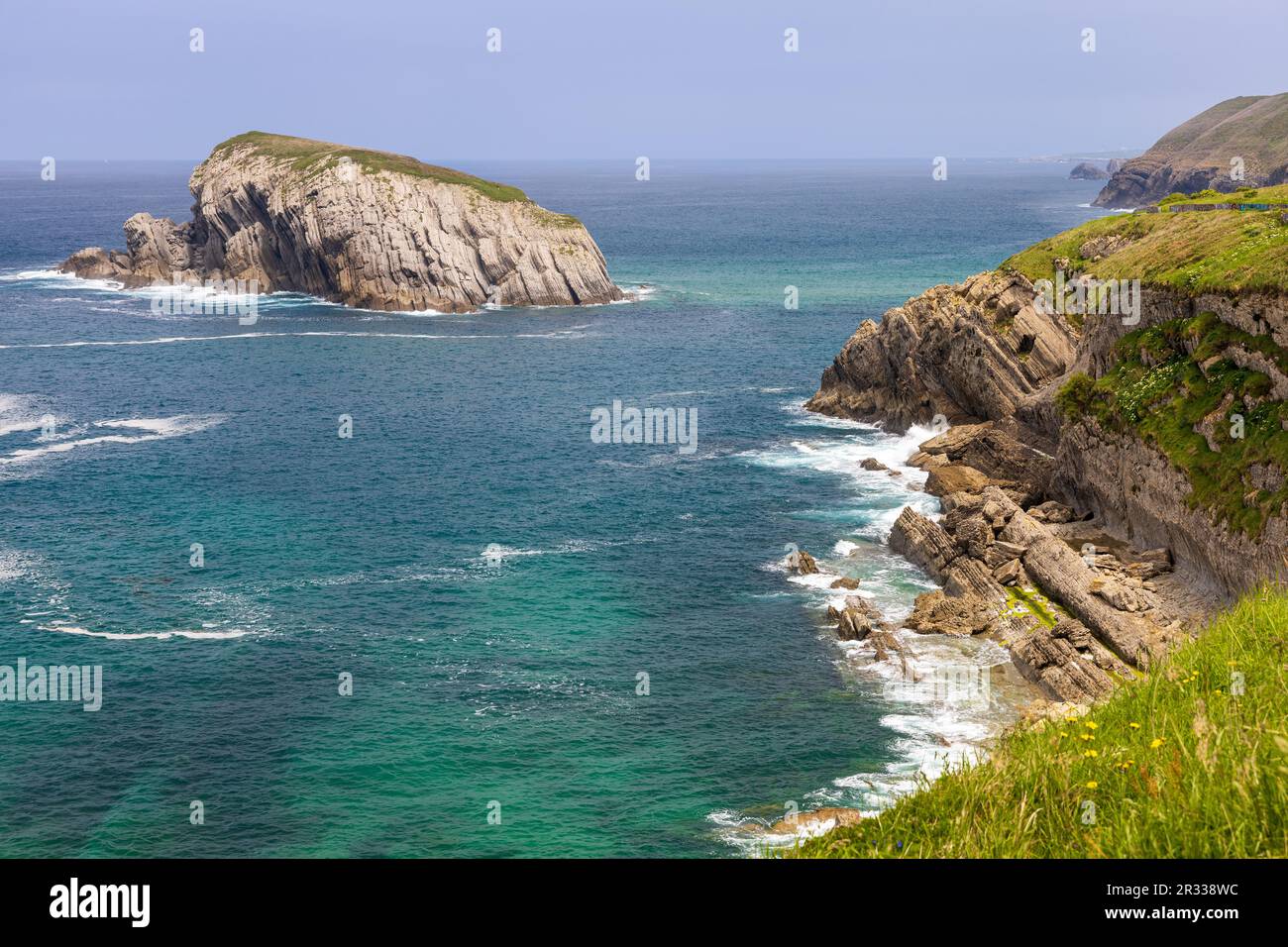 Atlantic ocean, Isla del Castro island and the rocks. Coast of Soto de ...