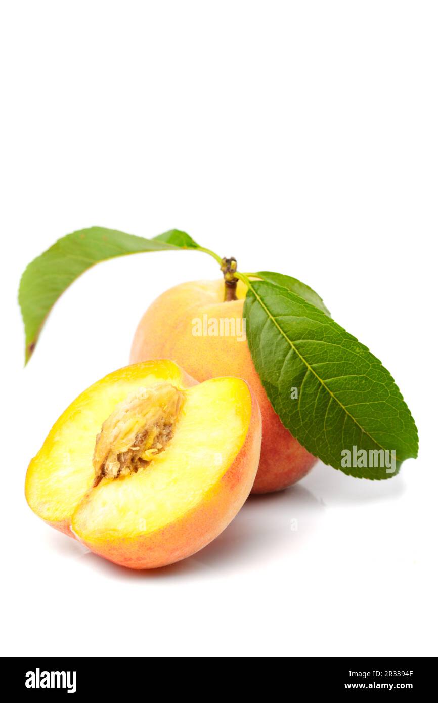 Peach half green leaf hi-res stock photography and images - Alamy