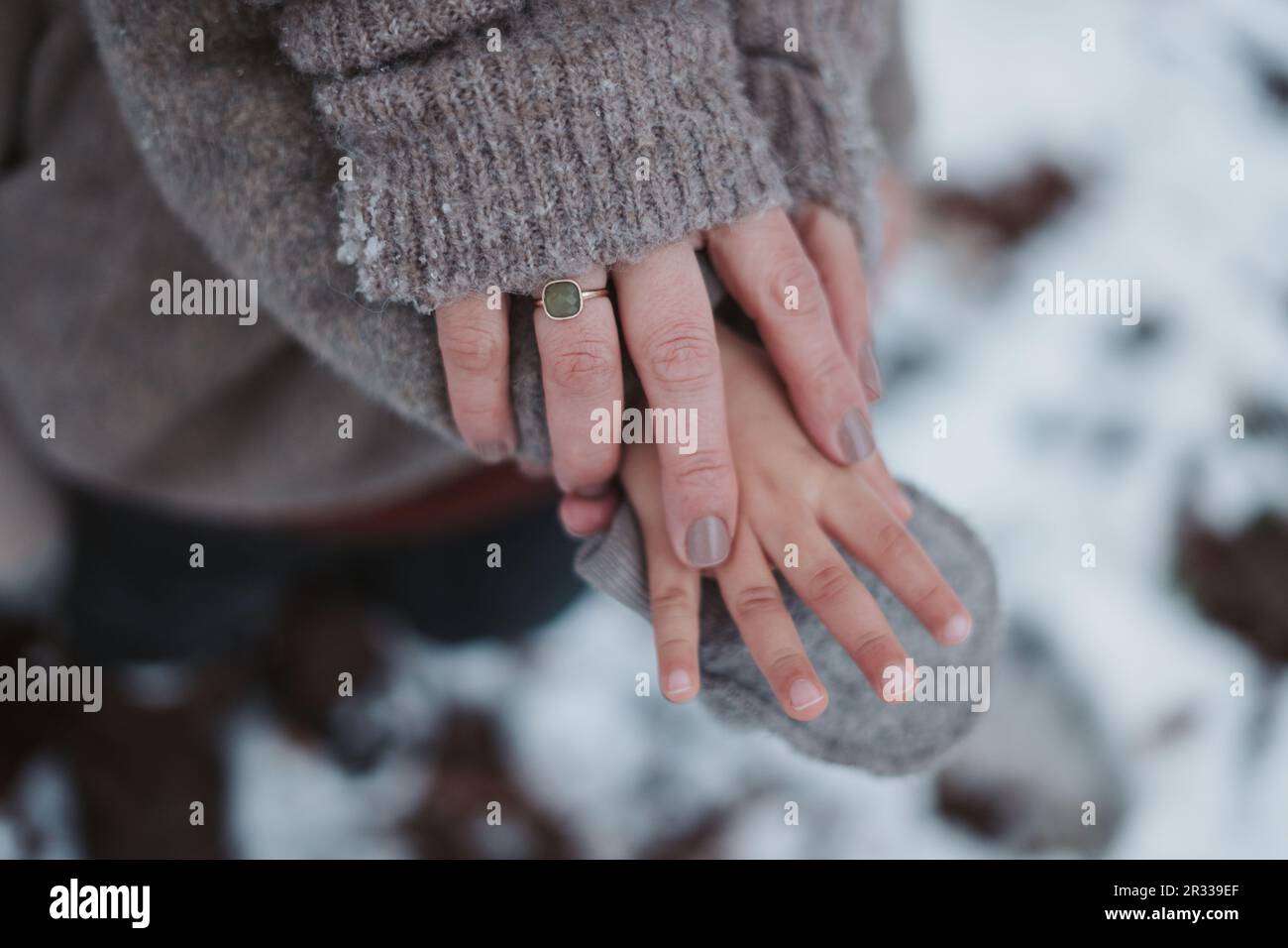 hands from mother and children together outside showing love and care ...