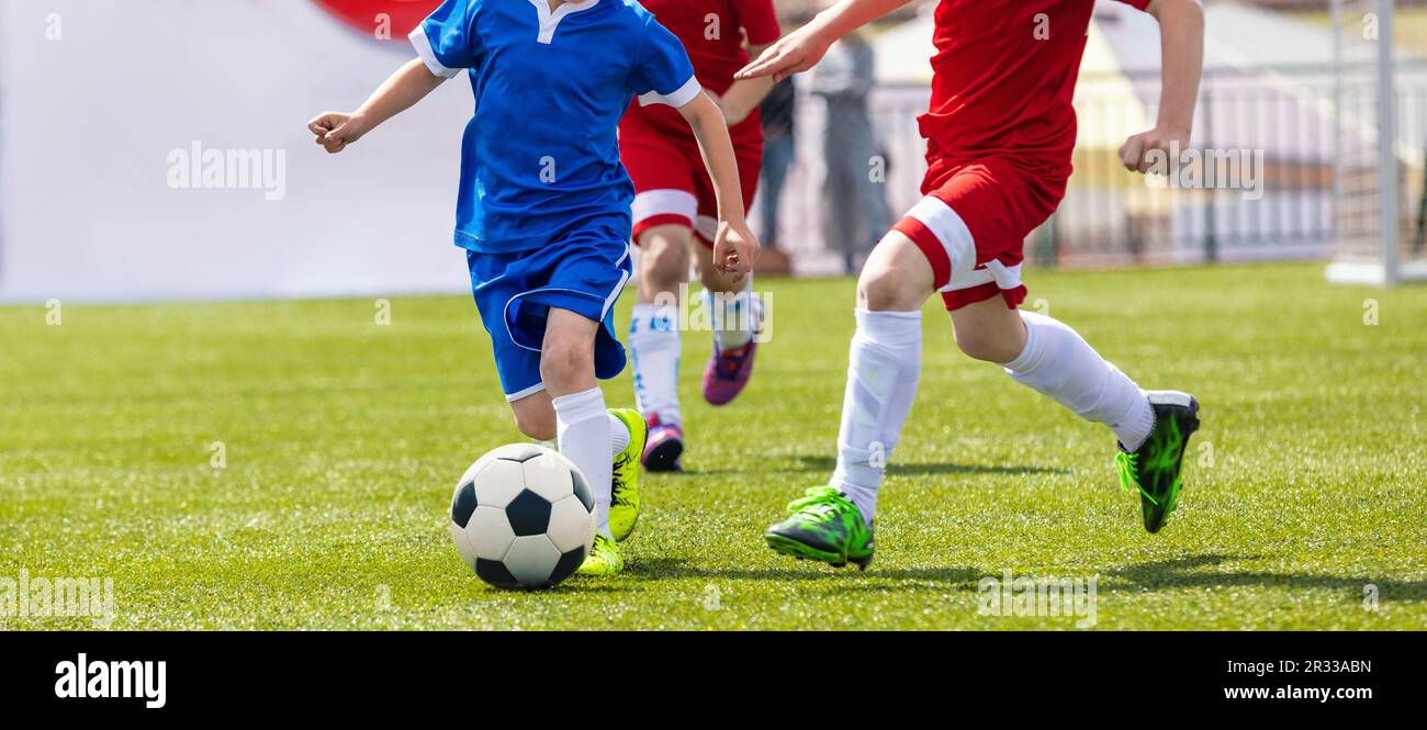Soccer Players in a Duel. Elementary Age Kids in Soccer Clubs of Soccer ...