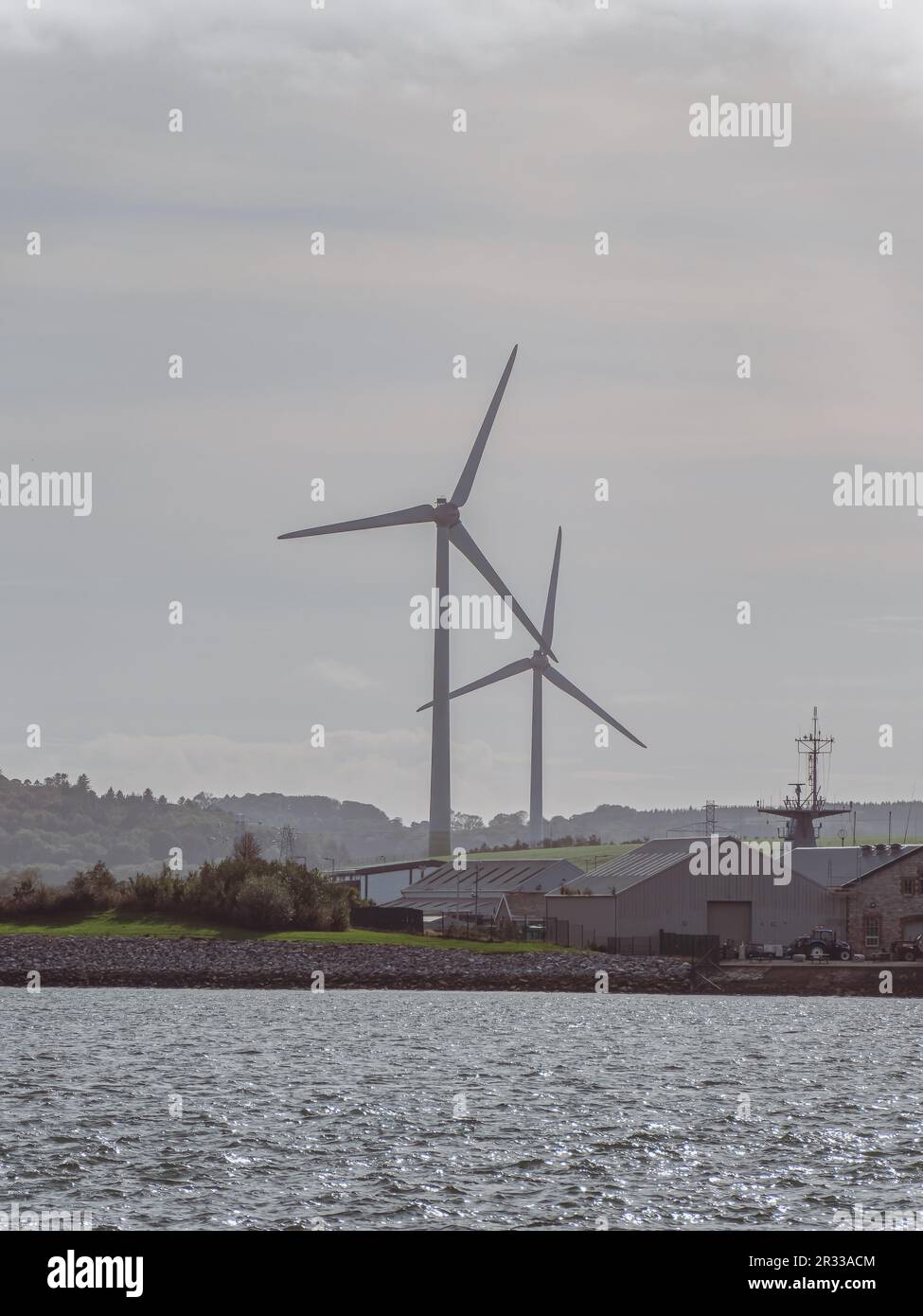 Wind power generators in the south of Ireland, landscape. Two wind ...