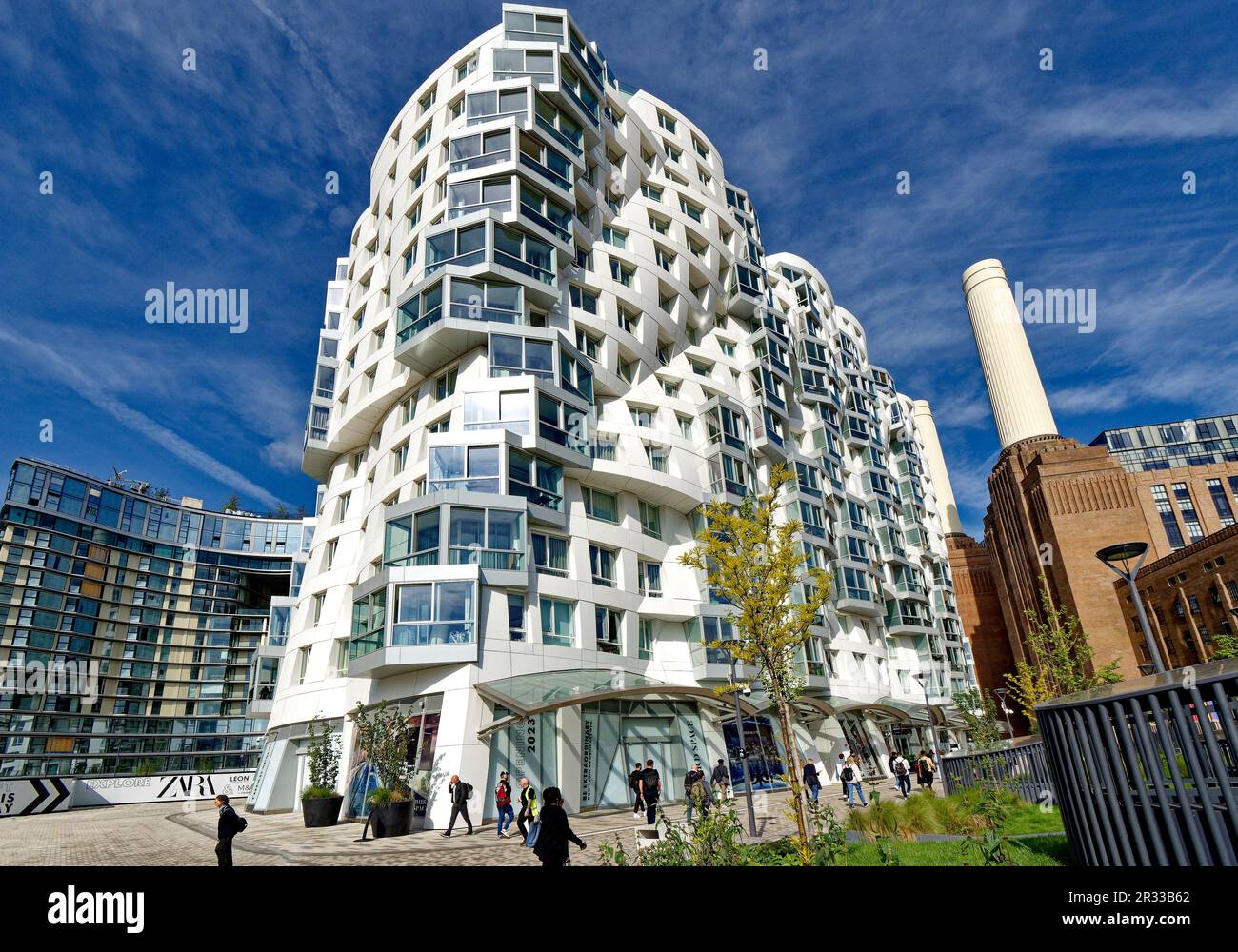 London Wandsworth Battersea large white apartment building with shops ...