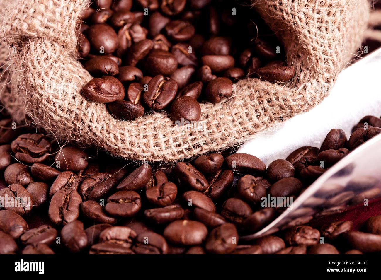 Coffee beans spilling Stock Photo - Alamy