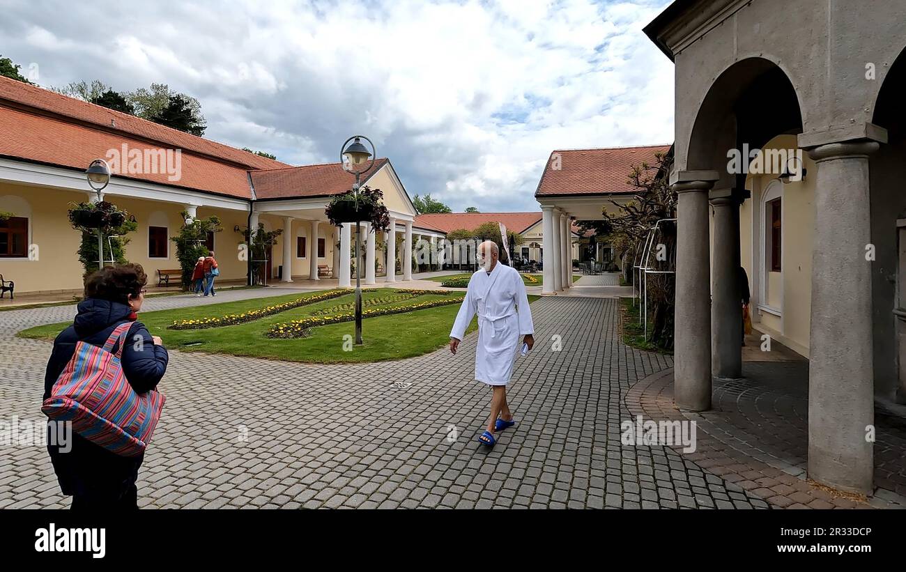 People walk in what is so called "the Spa island" in Piestany, Slovakia ...