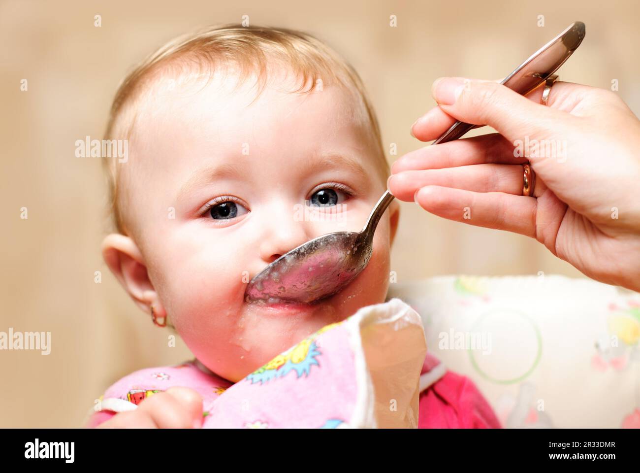 Toddler holding spoon hi-res stock photography and images - Alamy