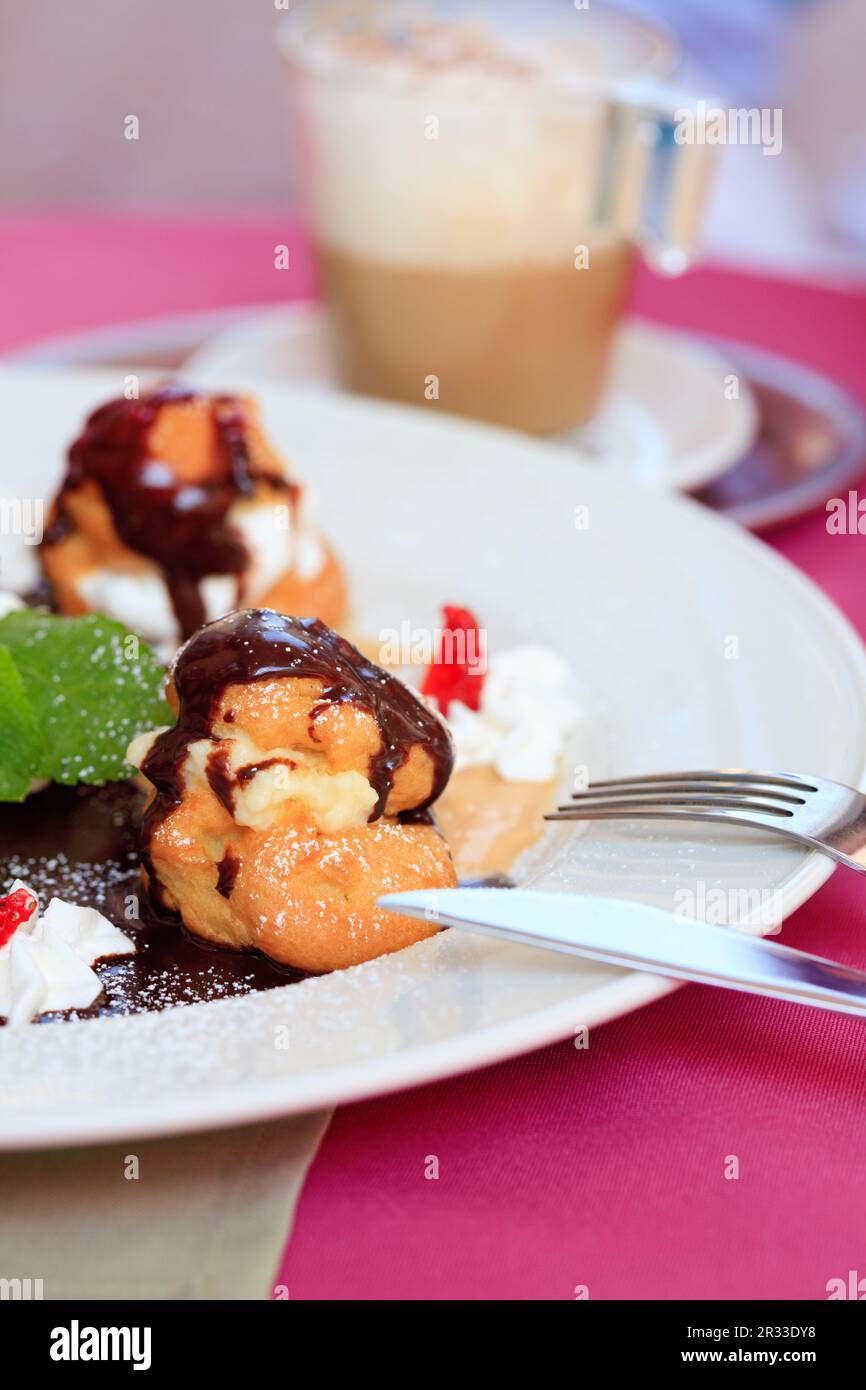 Plate chocolate profiteroles close hi-res stock photography and images ...