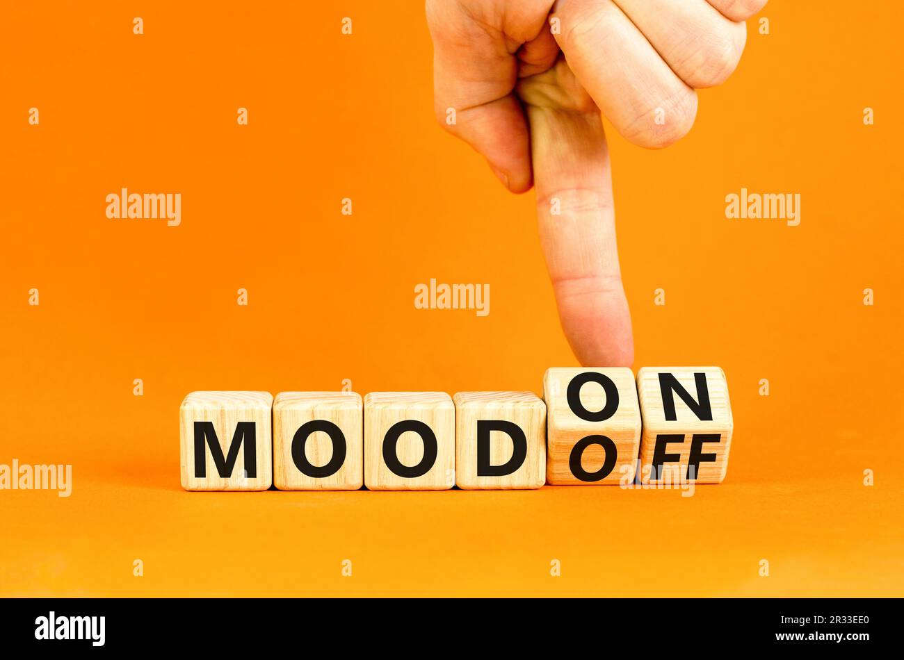Mood on or off symbol. Businessman turns wooden cubes and changes word ...