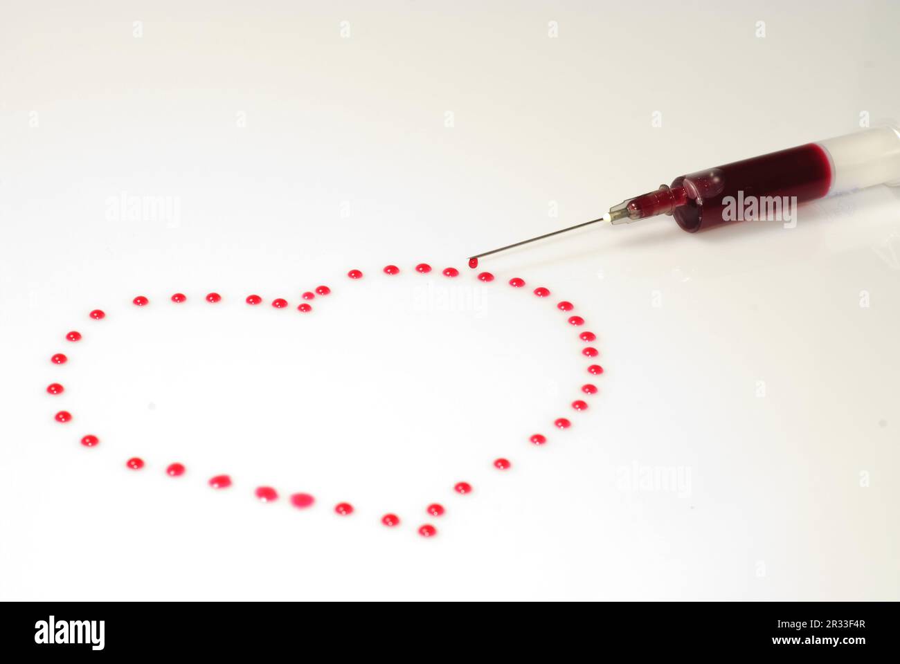 Red drops heart Stock Photo - Alamy